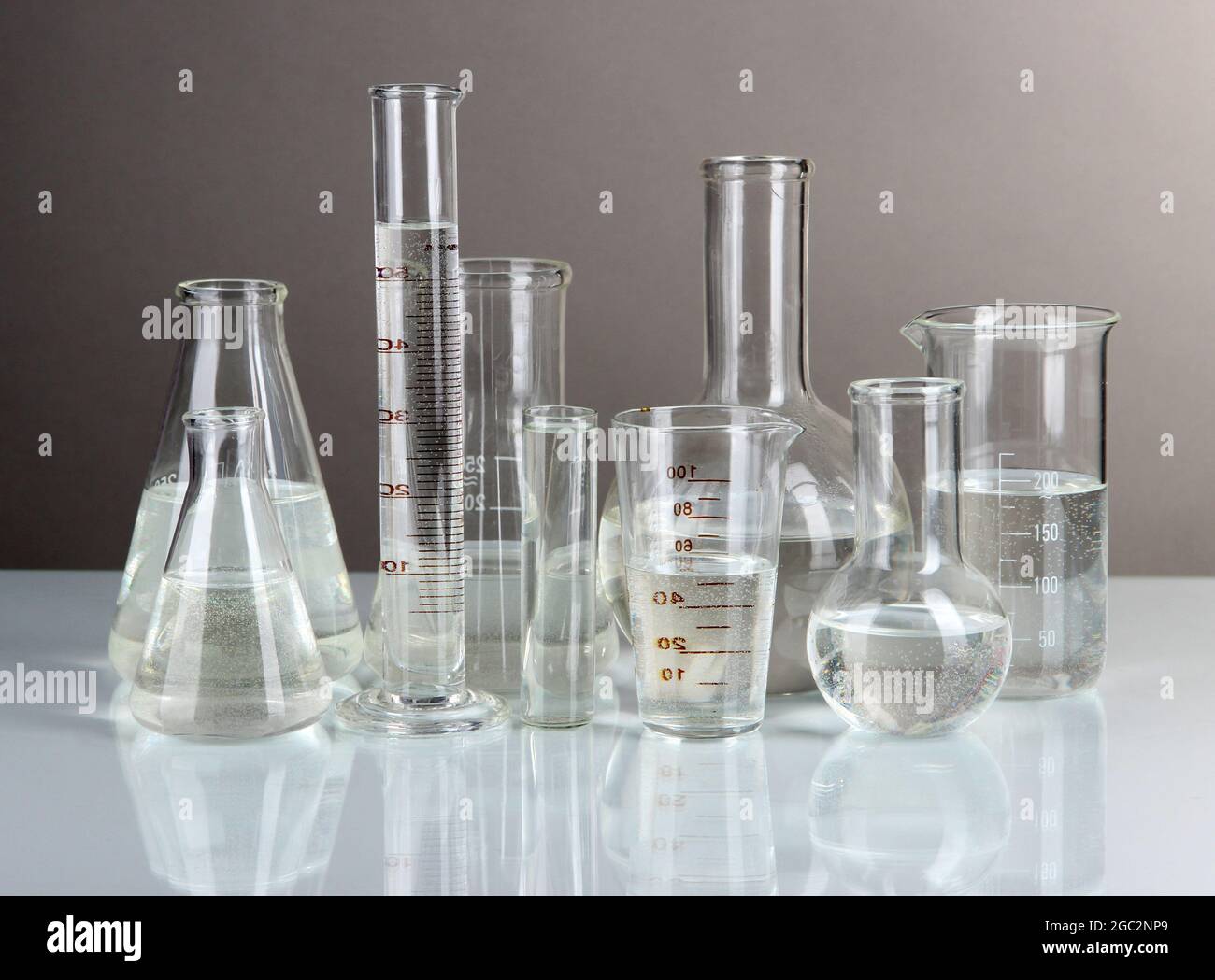 Test tubes on gray background Stock Photo - Alamy