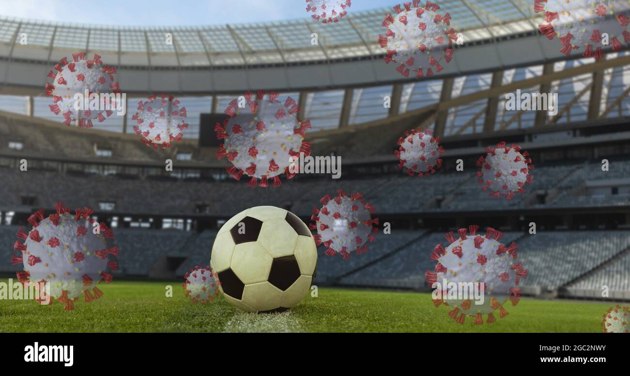 Covid-19 cells against soccer ball on sports stadium Stock Photo - Alamy