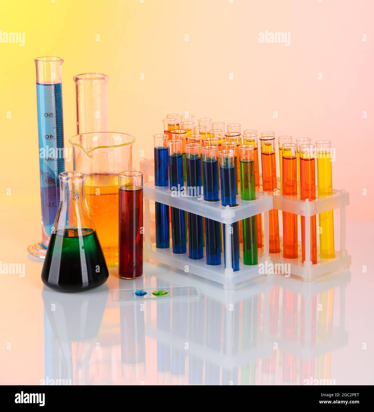 Colorful test tubes on light background Stock Photo - Alamy