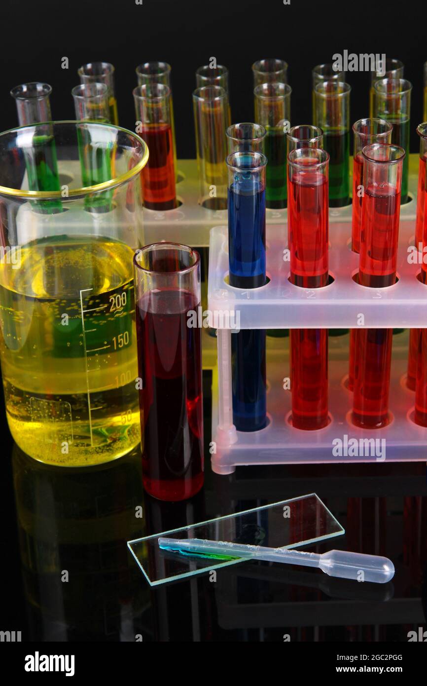 Colorful test tubes on bright background Stock Photo - Alamy