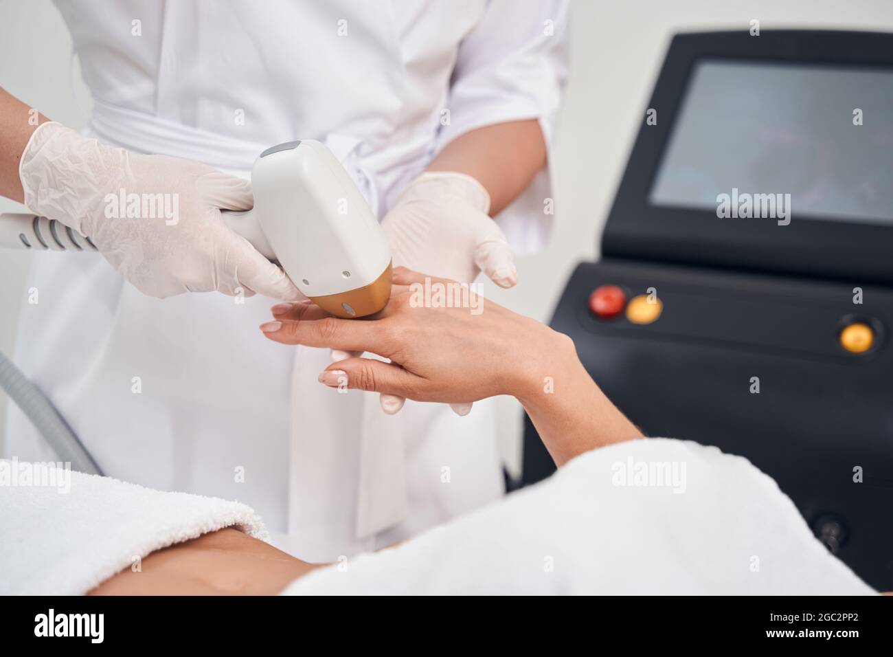Doctor doing laser on woman hi-res stock photography and images - Alamy