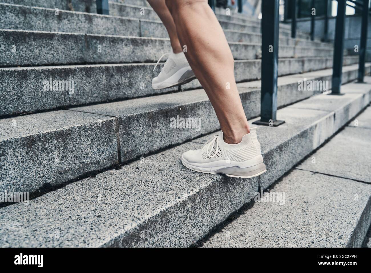 Legs of running person moving on stairs Stock Photo - Alamy