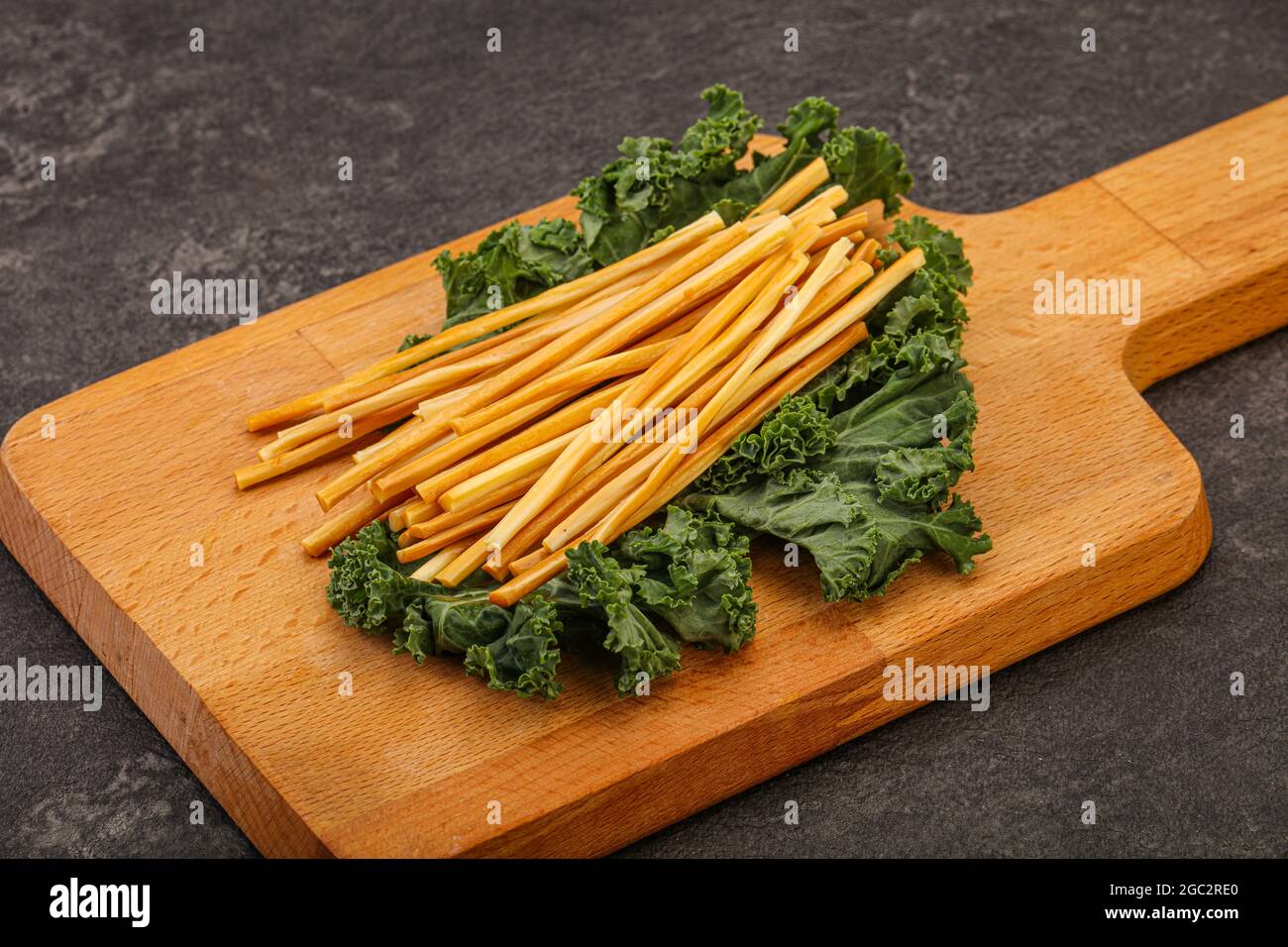Caucasian Chechel cheese sticks over board Stock Photo - Alamy