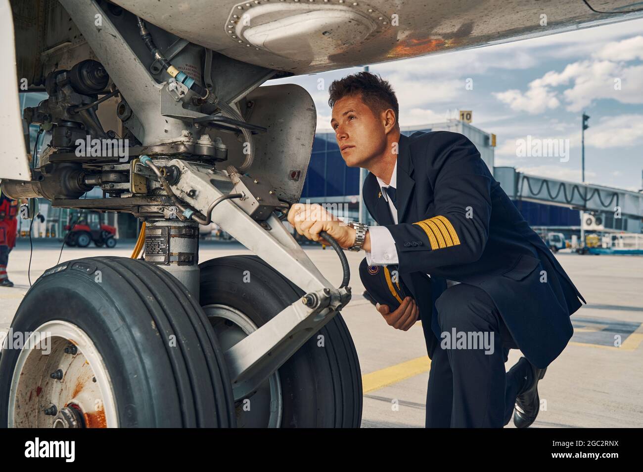 Licensed pilot examining the landing gear system Stock Photo - Alamy