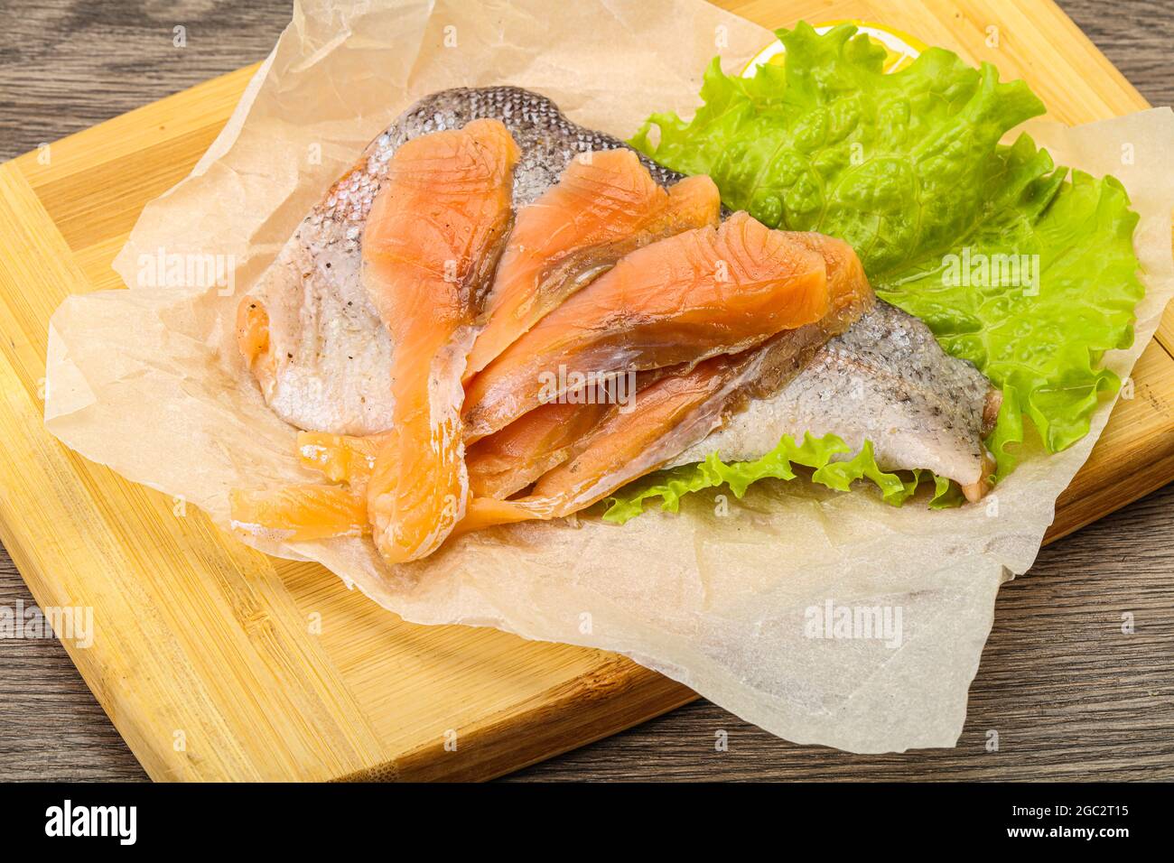 Sliced natural wild trout fillet over board Stock Photo - Alamy