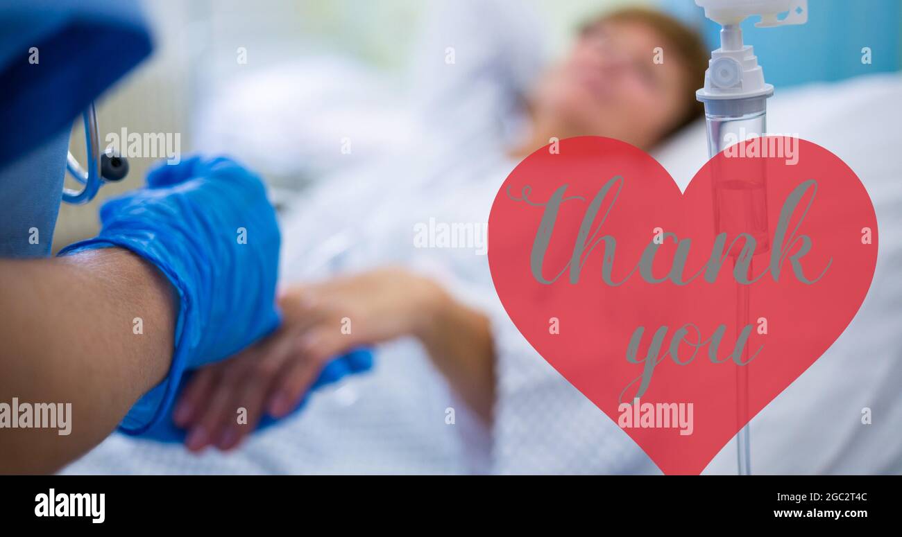 Animation of thank you text over doctor with patient Stock Photo - Alamy