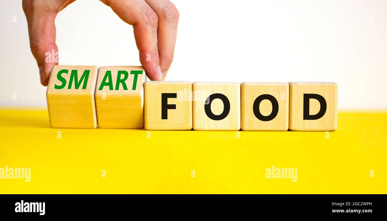 Smart food symbol. Doctor turns cubes and changes words 'food' to ...