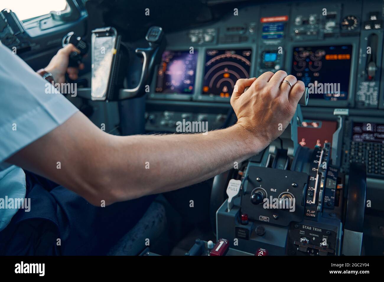 Aviator seated in the flight deck piloting an aircraft Stock Photo - Alamy