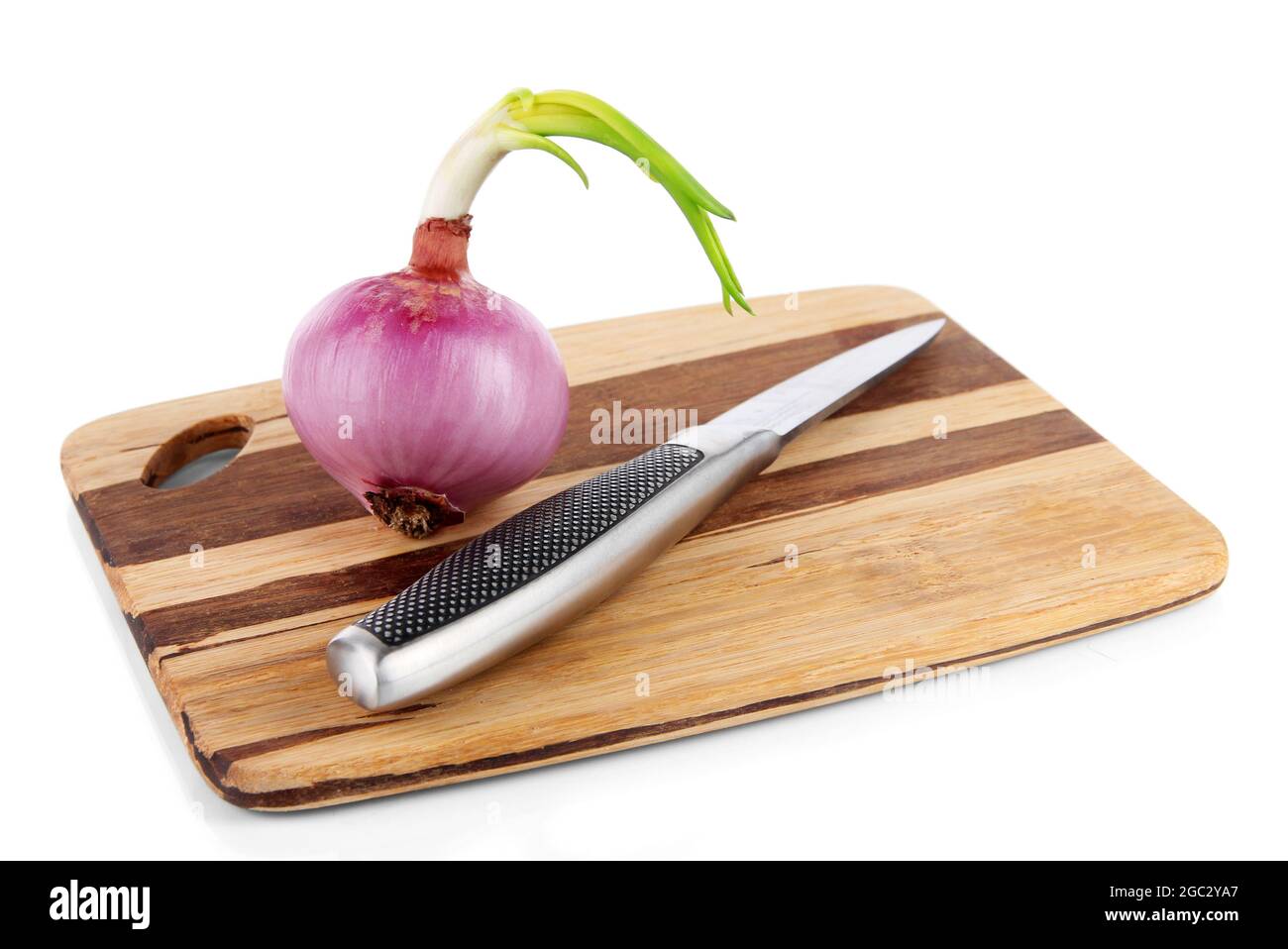 Sprouting onions on board isolated on white Stock Photo - Alamy