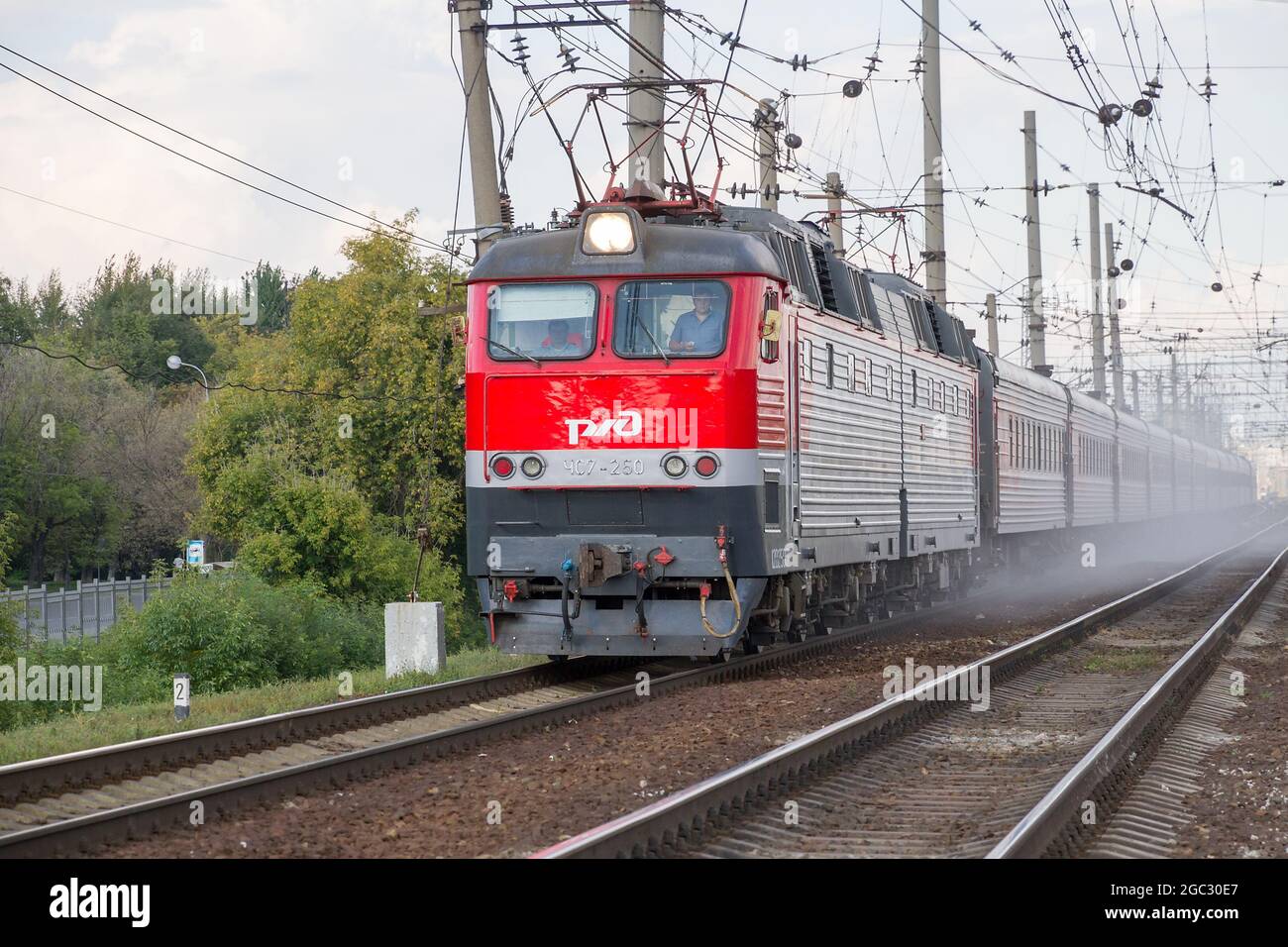 Russia. Moscow. Railway. The electric locomotive ChS7 with a passenger ...
