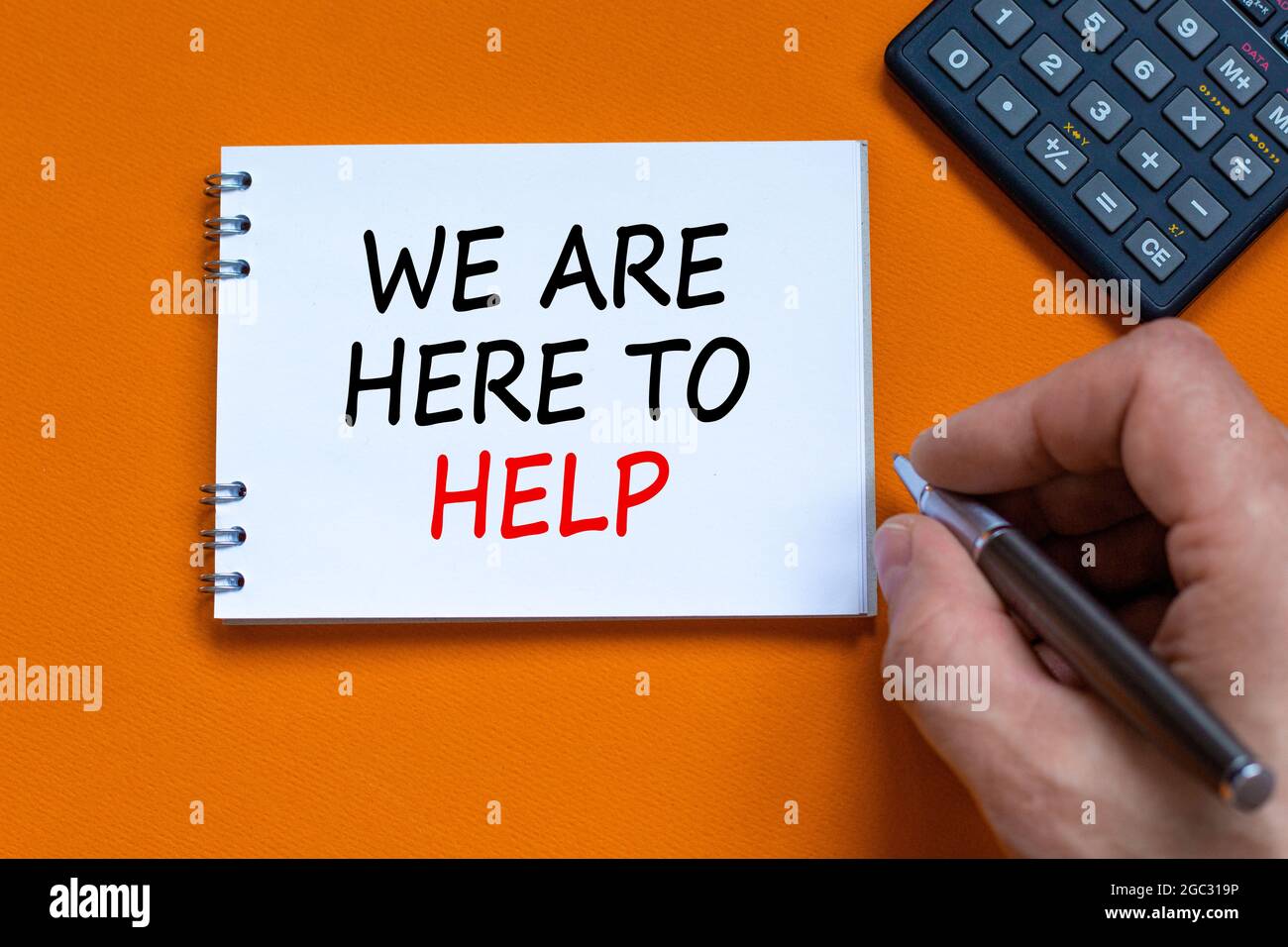 Support symbol. Businessman writing words 'we are here to help' on ...