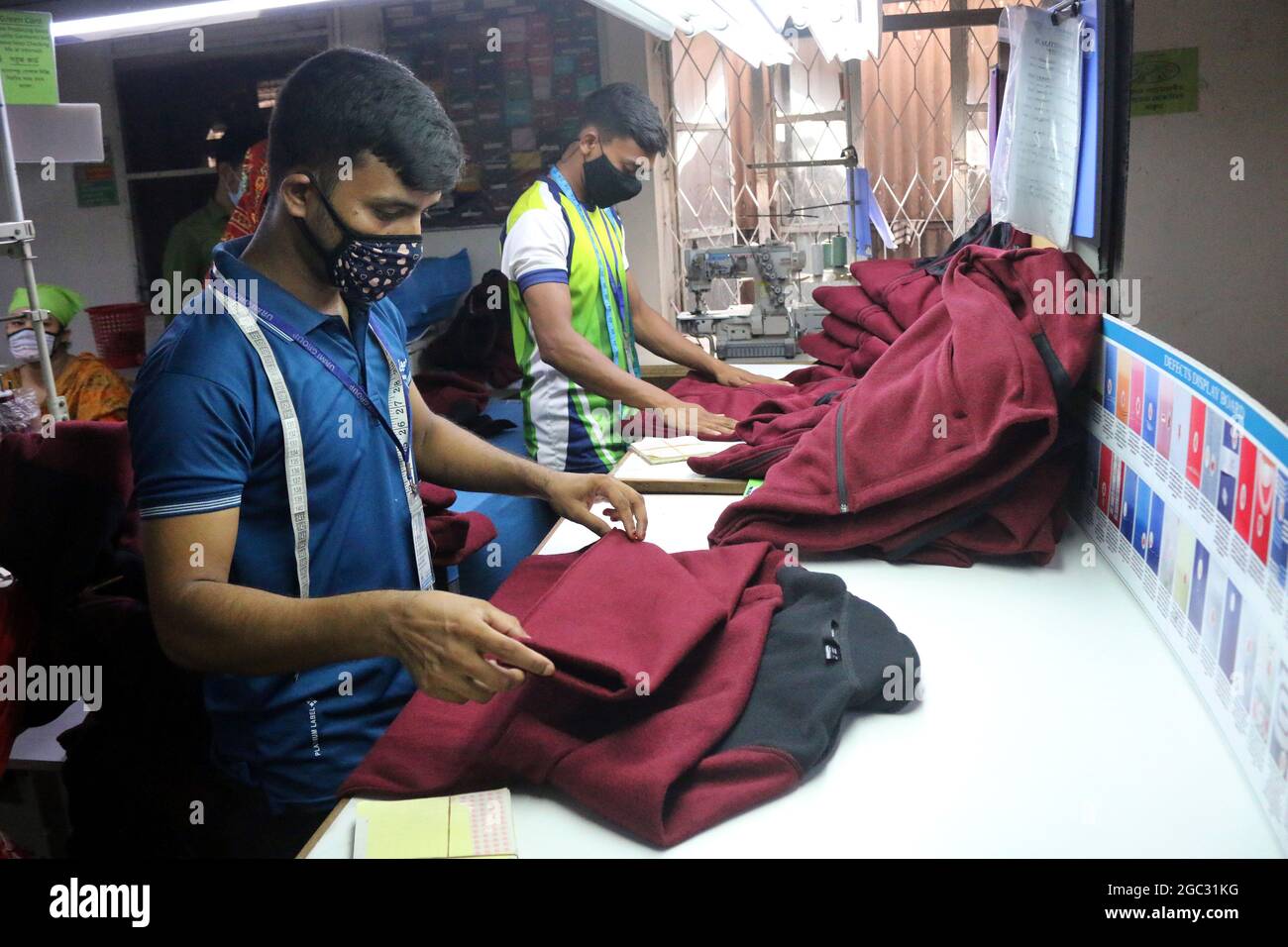 Non Exclusive: DHAKA, BANGLADESH - AUGUST 4, 2021: A man wears face ...