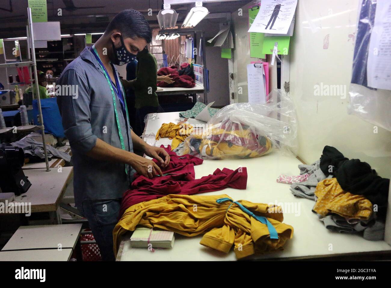 Non Exclusive: DHAKA, BANGLADESH - AUGUST 4, 2021: A man wears face ...