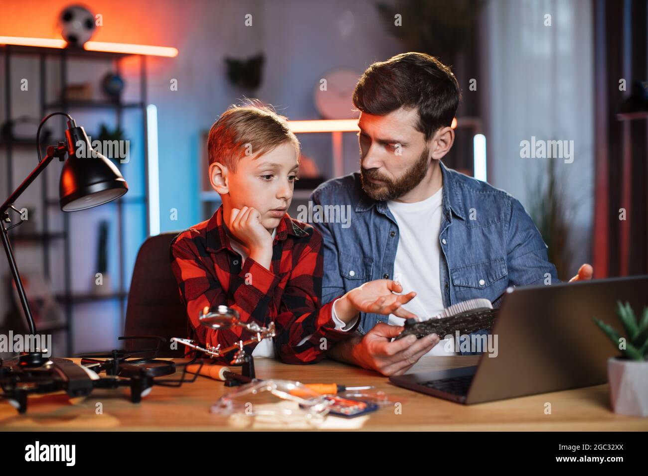 Father son fixing table High Resolution Stock Photography and Images ...