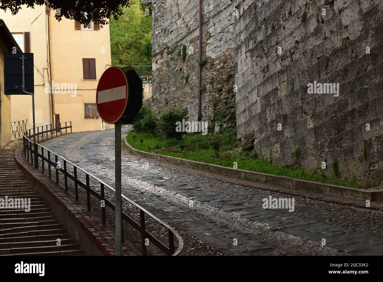 One red no entry traffic sign . The sign is hanging on a metal base ...