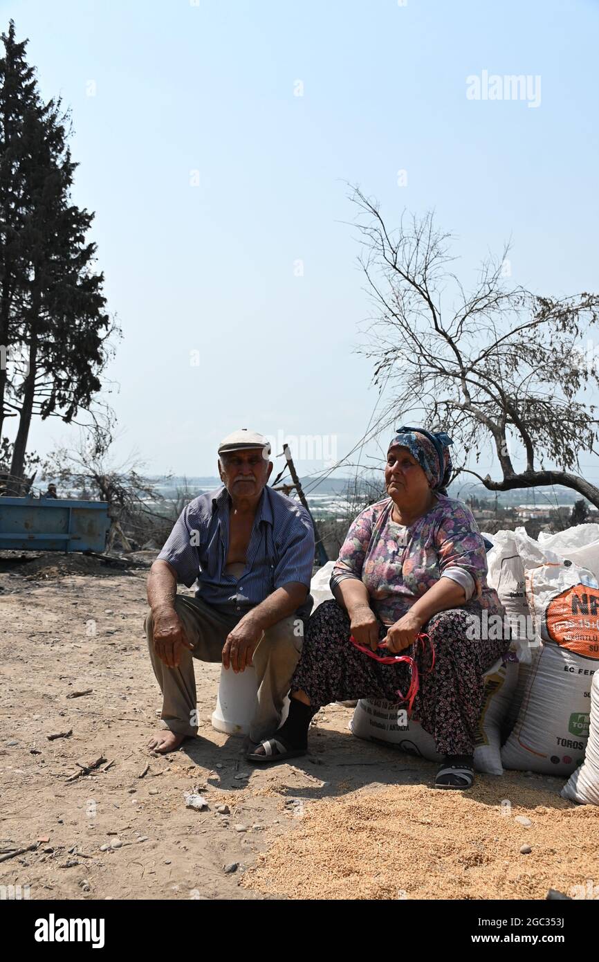 Kalemler, Turkey. 06th Aug, 2021. The Catal couple sits in front of ...