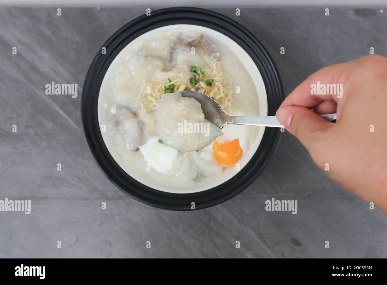 rice gruel or rice porridge or congee with pork liver, pork ball and ...