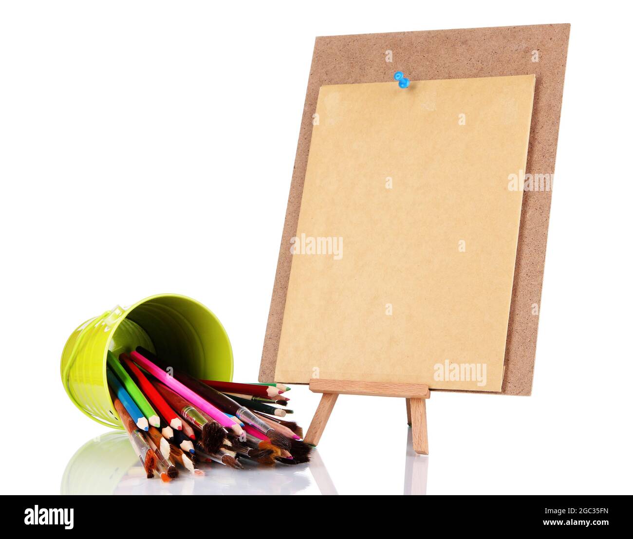 Small easel with sheet of paper with art supplies isolated on white ...