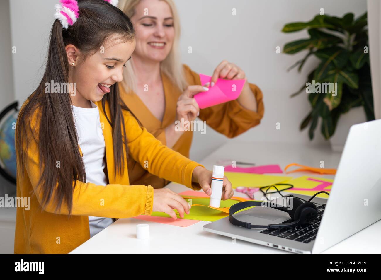 Online remote learning. School kids with computer having video ...