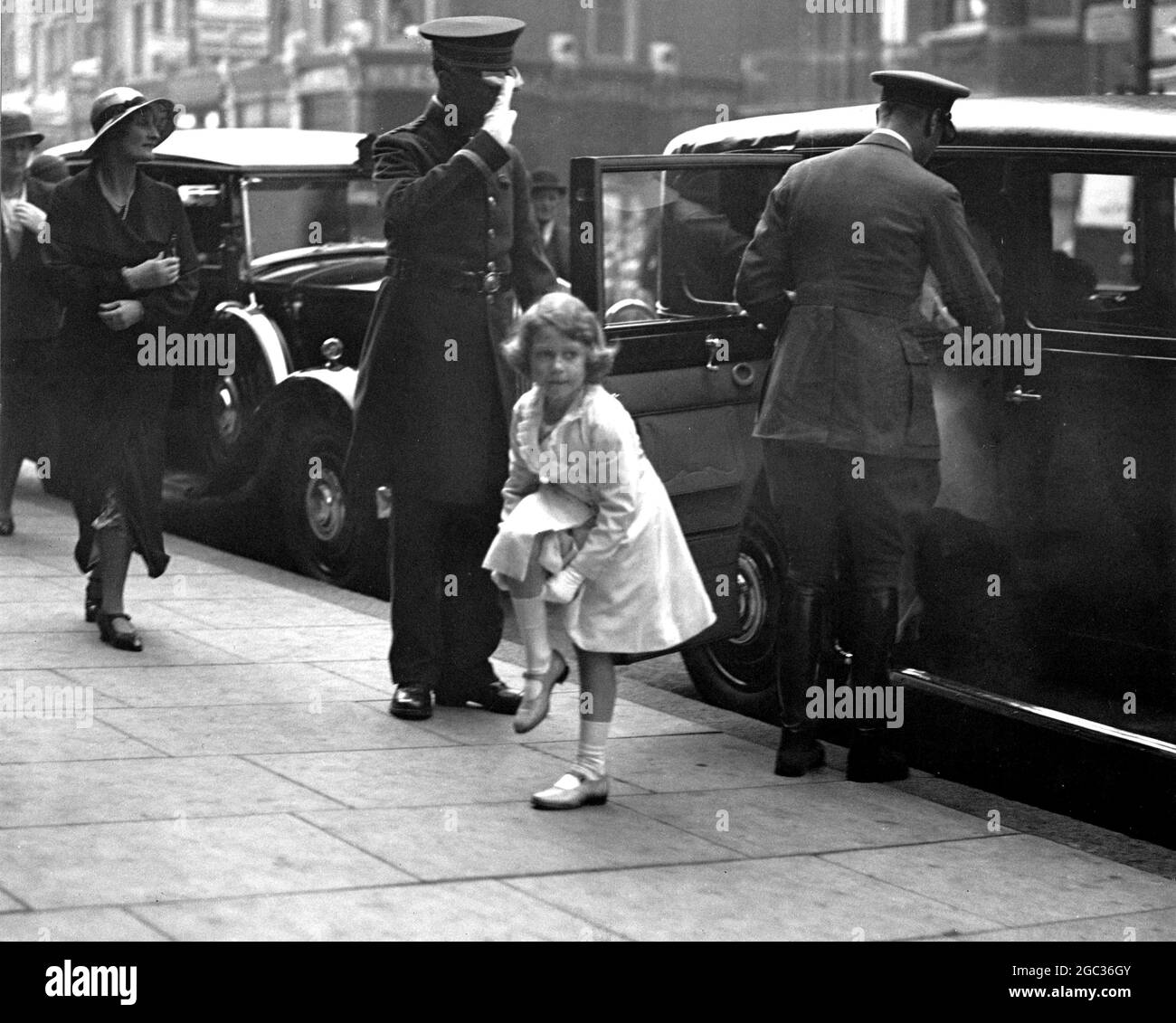 Princess Elizabeth arrives at Olympia on 3rd May 1933 (pulls her socks ...