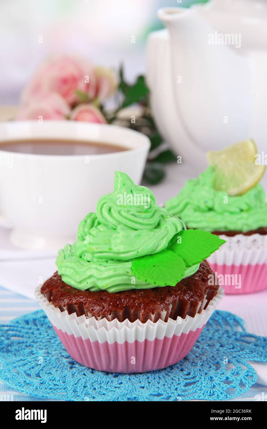 Beautiful cupcakes on dining table on room background Stock Photo - Alamy