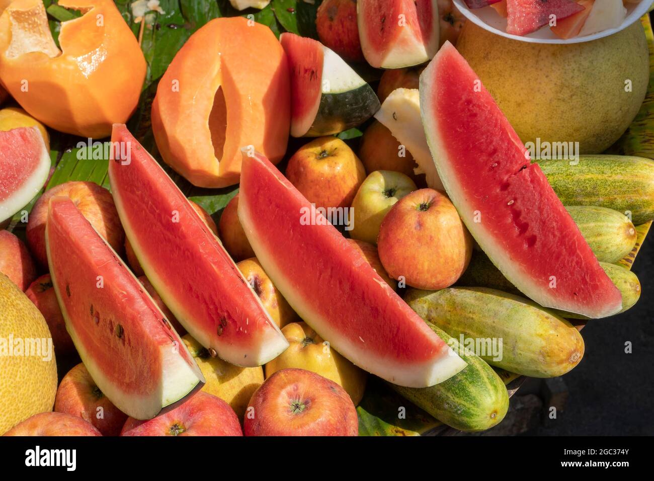 Watermelon - Citrullus lanatus -pieces are cut and being sold with ...