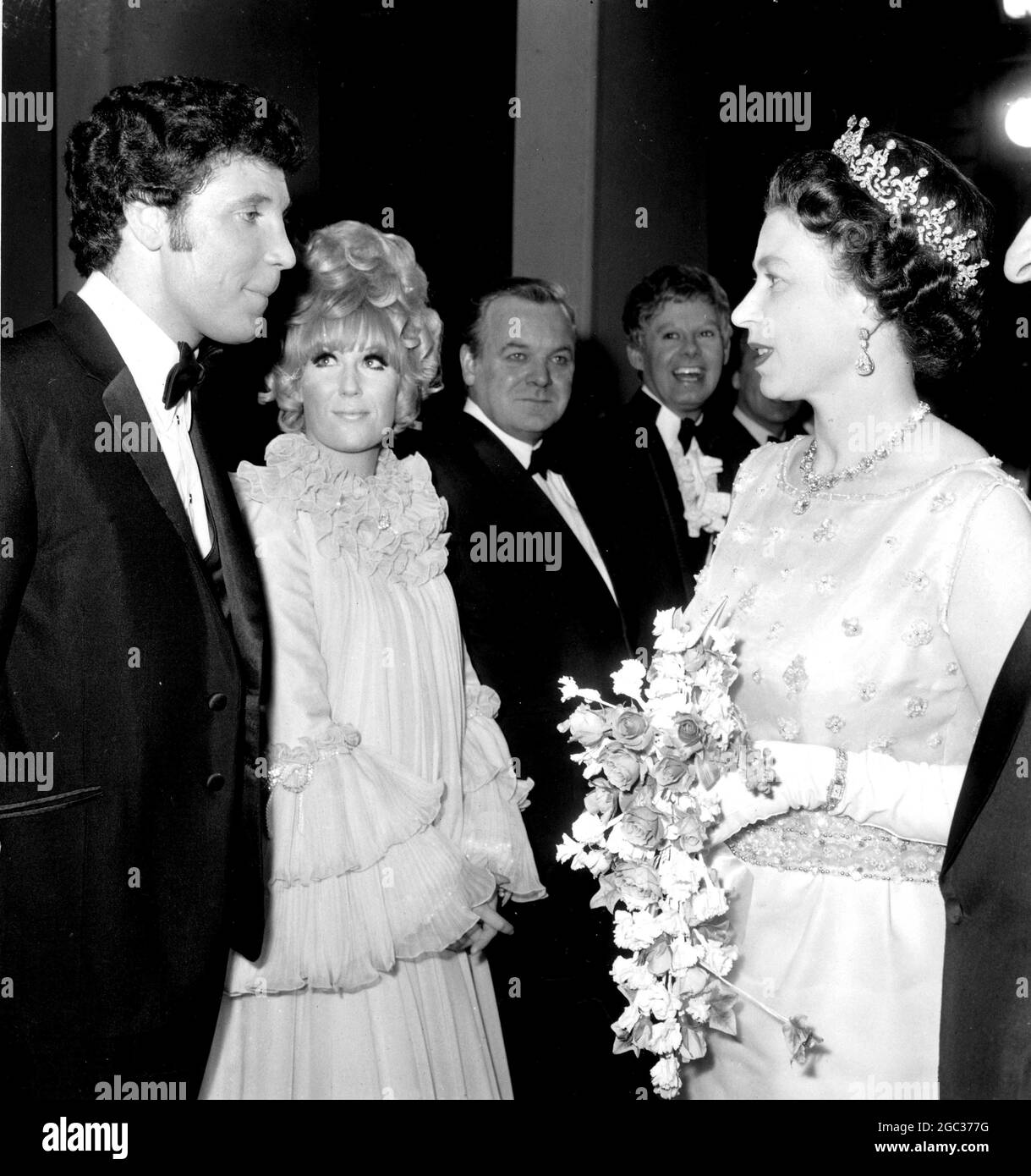 Welsh-born pop star Tom Jones talking with Her Majesty the Queen before ...
