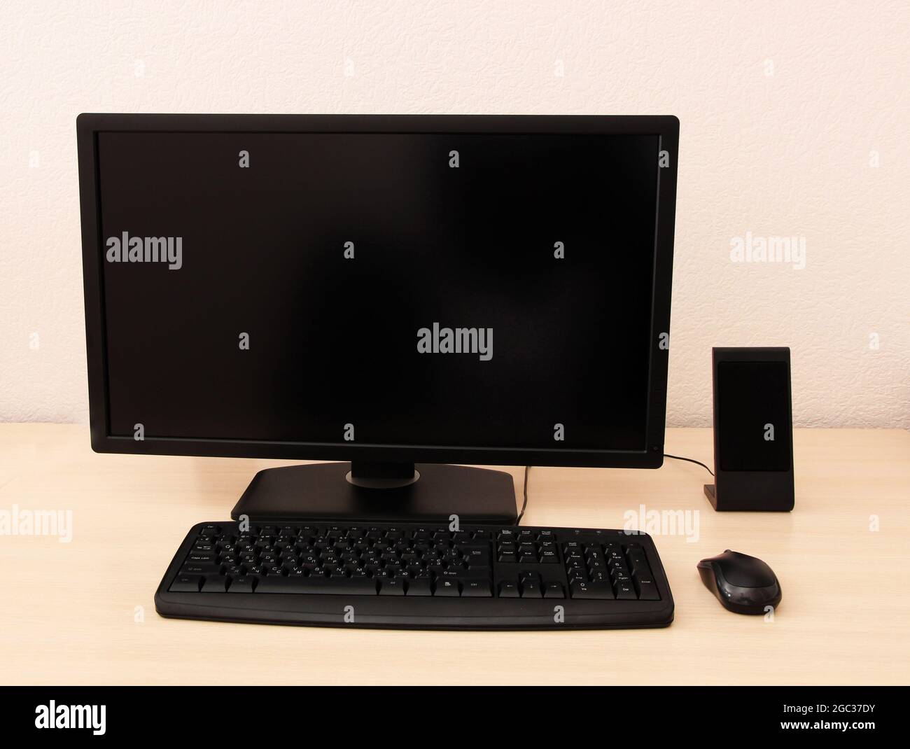 Computer on table in room Stock Photo - Alamy