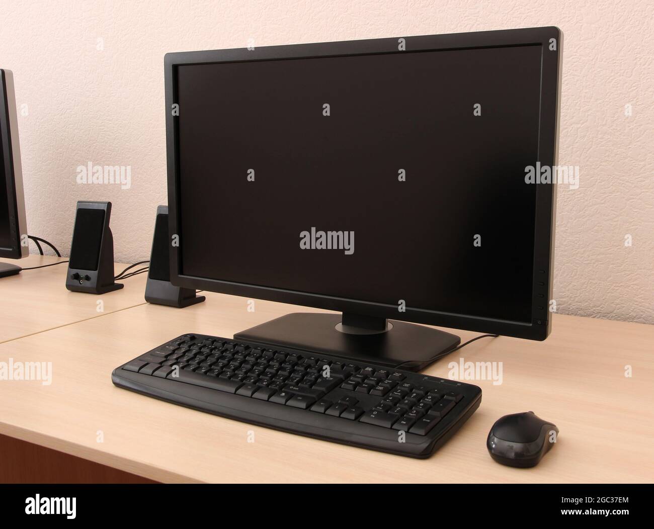 Computer on table in room Stock Photo - Alamy