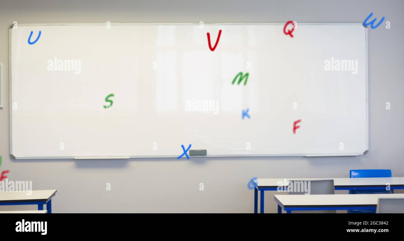 Digital composition of multiple colorful alphabets floating against white board in empty ...