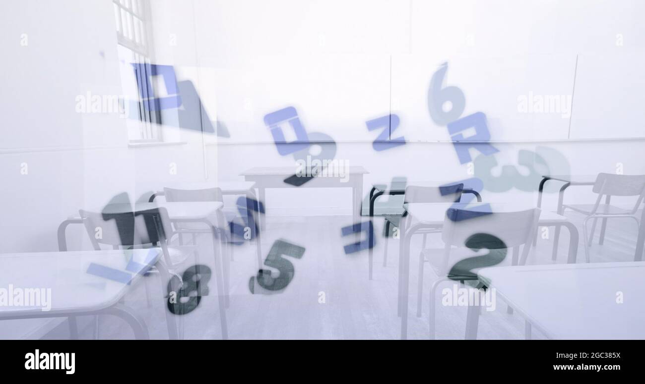 Digital composition of changing numbers and alphabets floating against empty classroom Stock ...