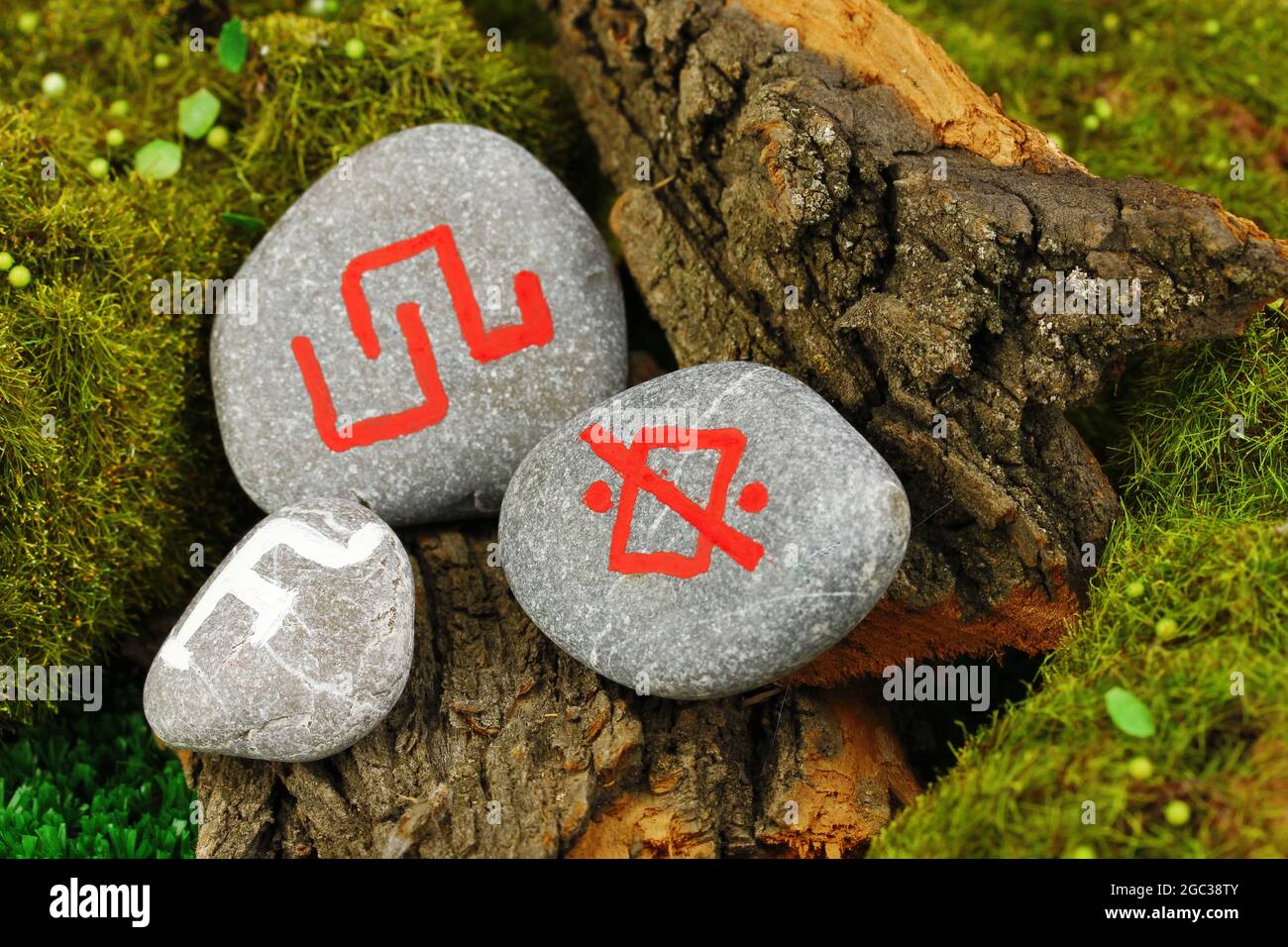 Fortune telling with symbols on stone close up Stock Photo - Alamy