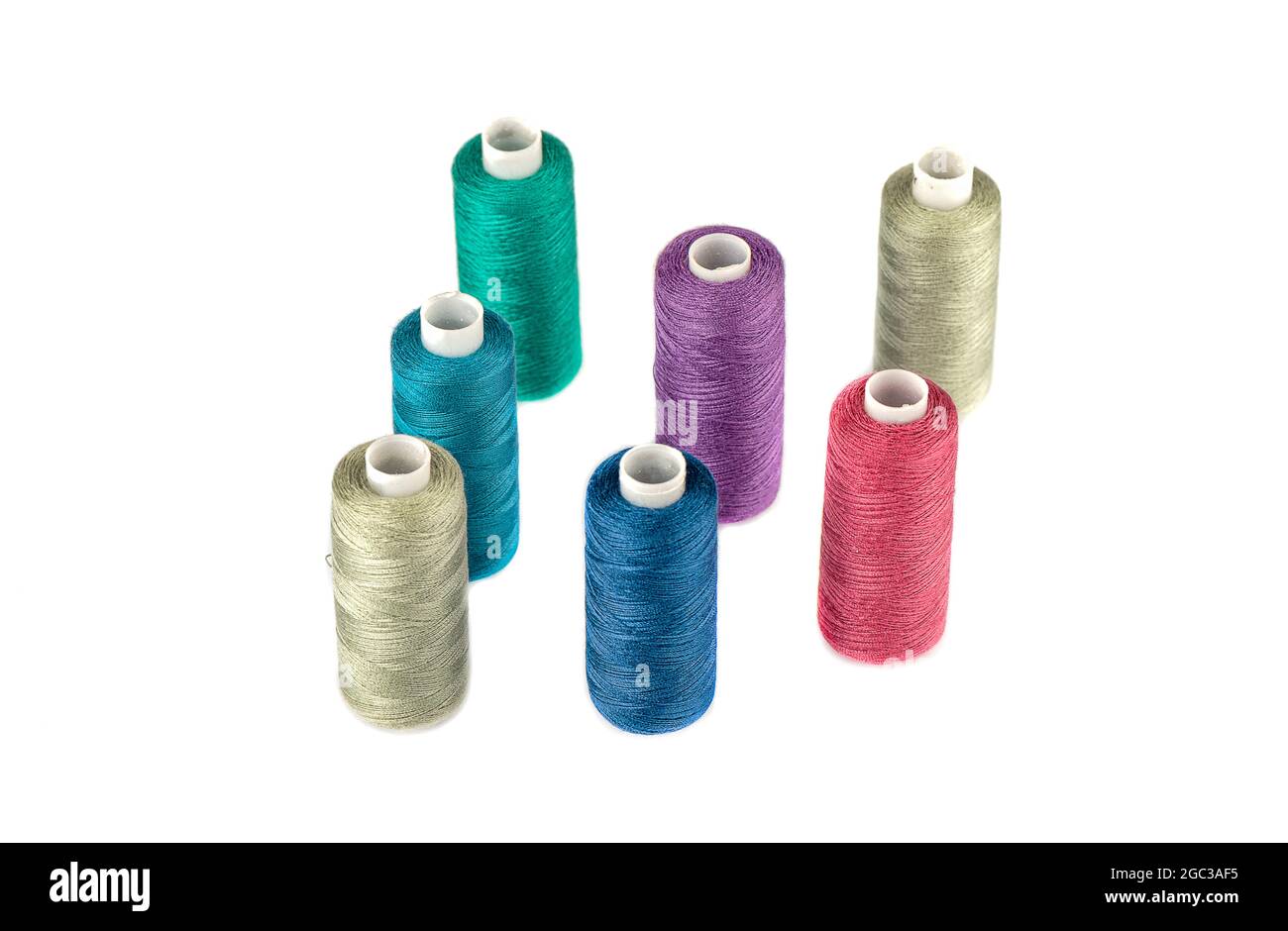 Top view of colorful spools of thread isolated on white background ...