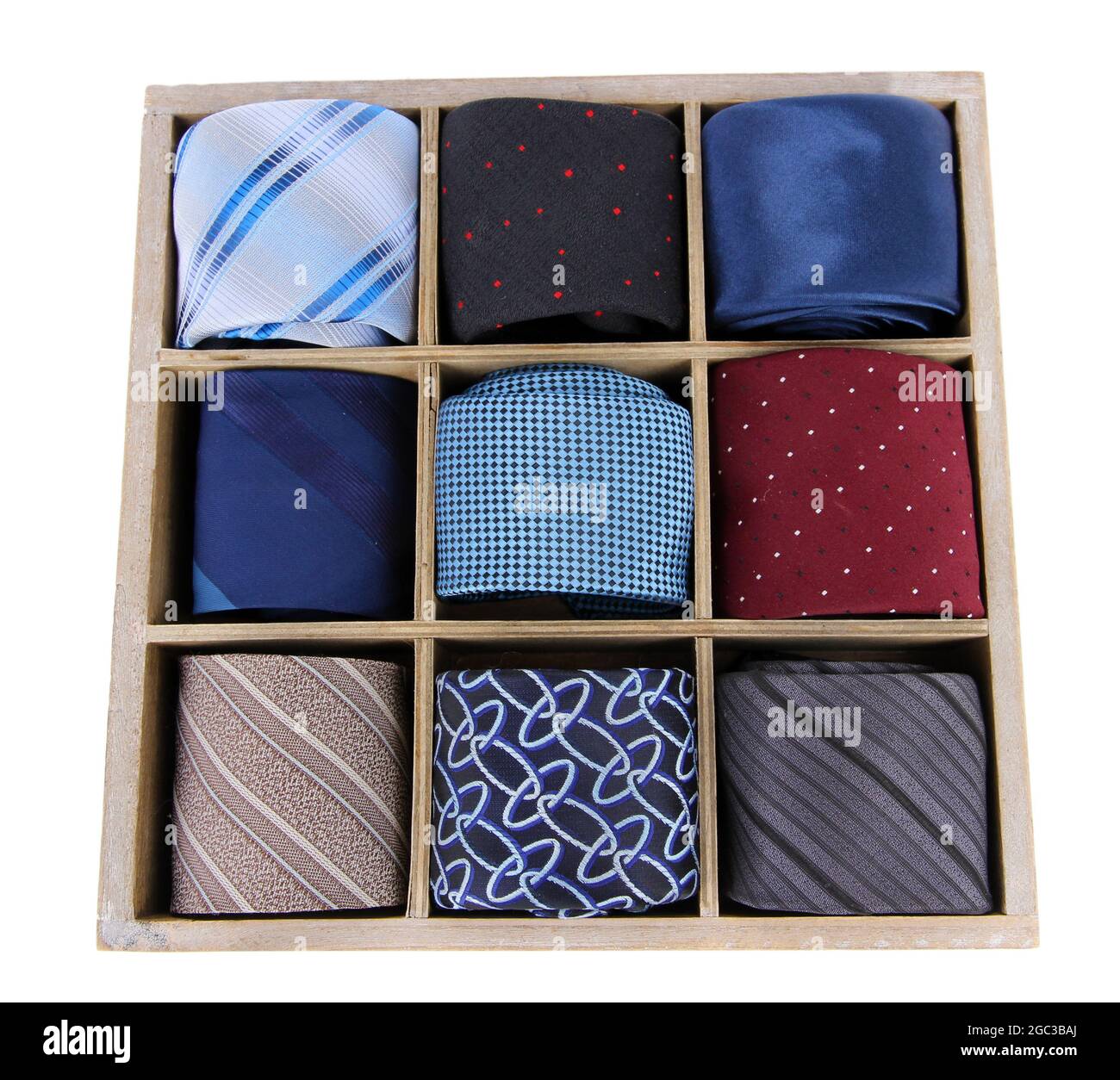 Neckties in wooden box isolated on white Stock Photo - Alamy