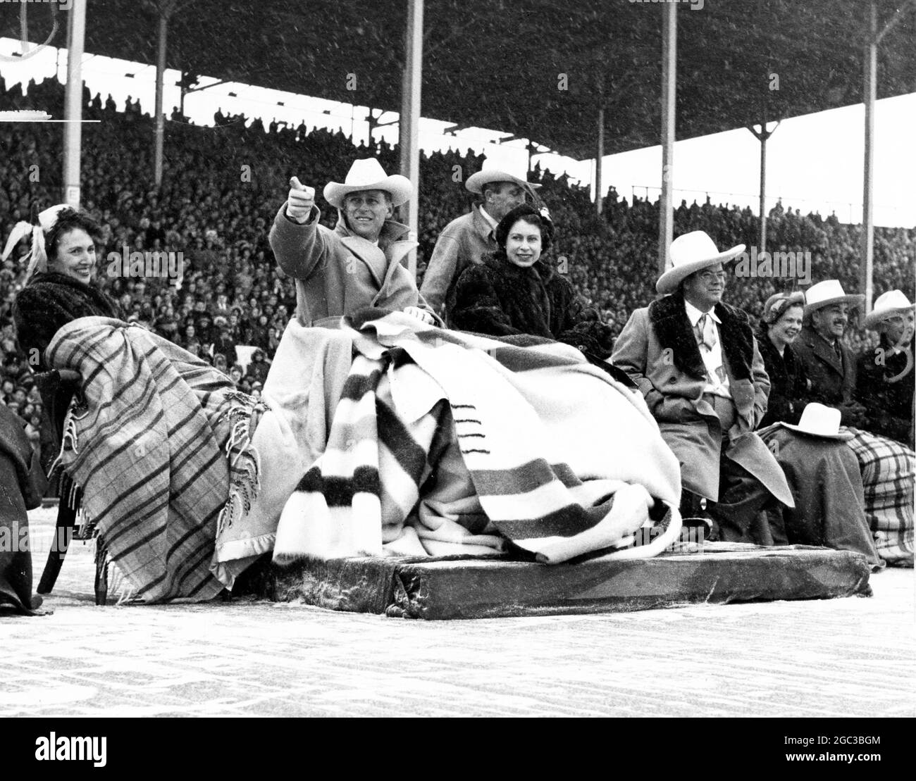 Queen Elizabeth II wearing a blanket ( a wedding present from Canada ...