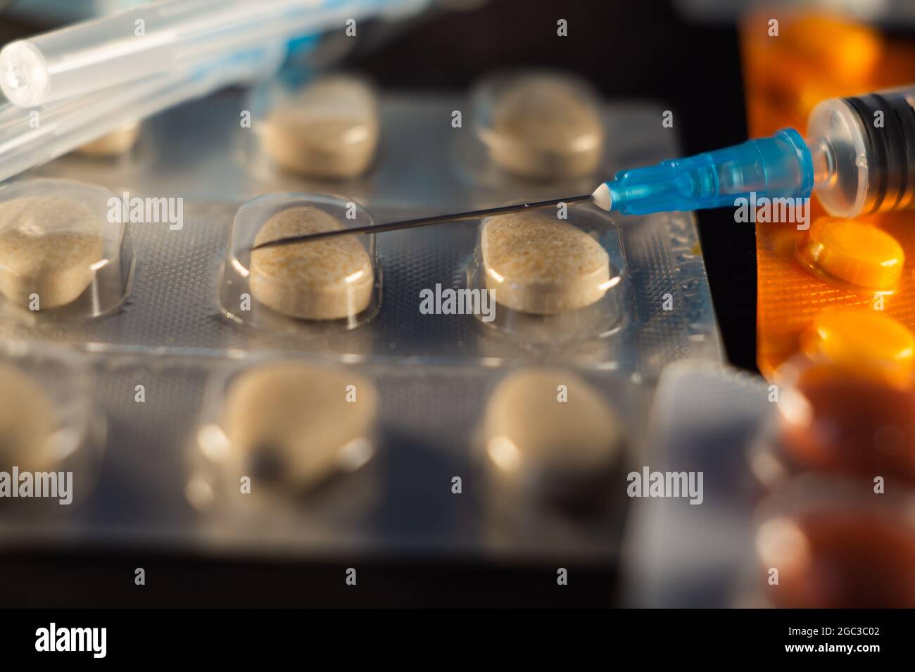 Closeup shot of pharmaceutical capsules, pills and syringes Stock Photo ...