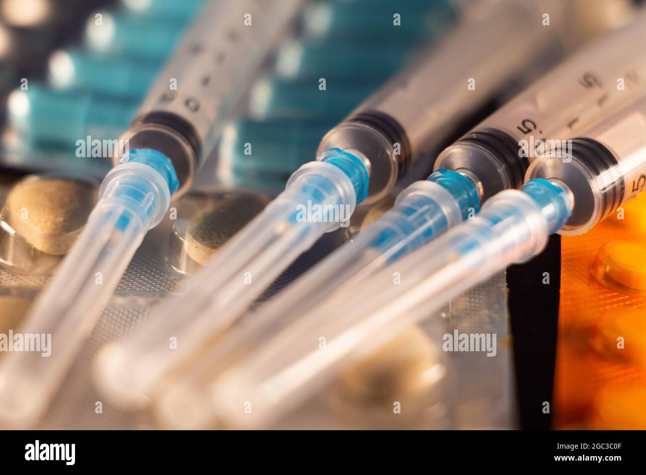 Closeup shot of pharmaceutical capsules, pills and syringes Stock Photo ...