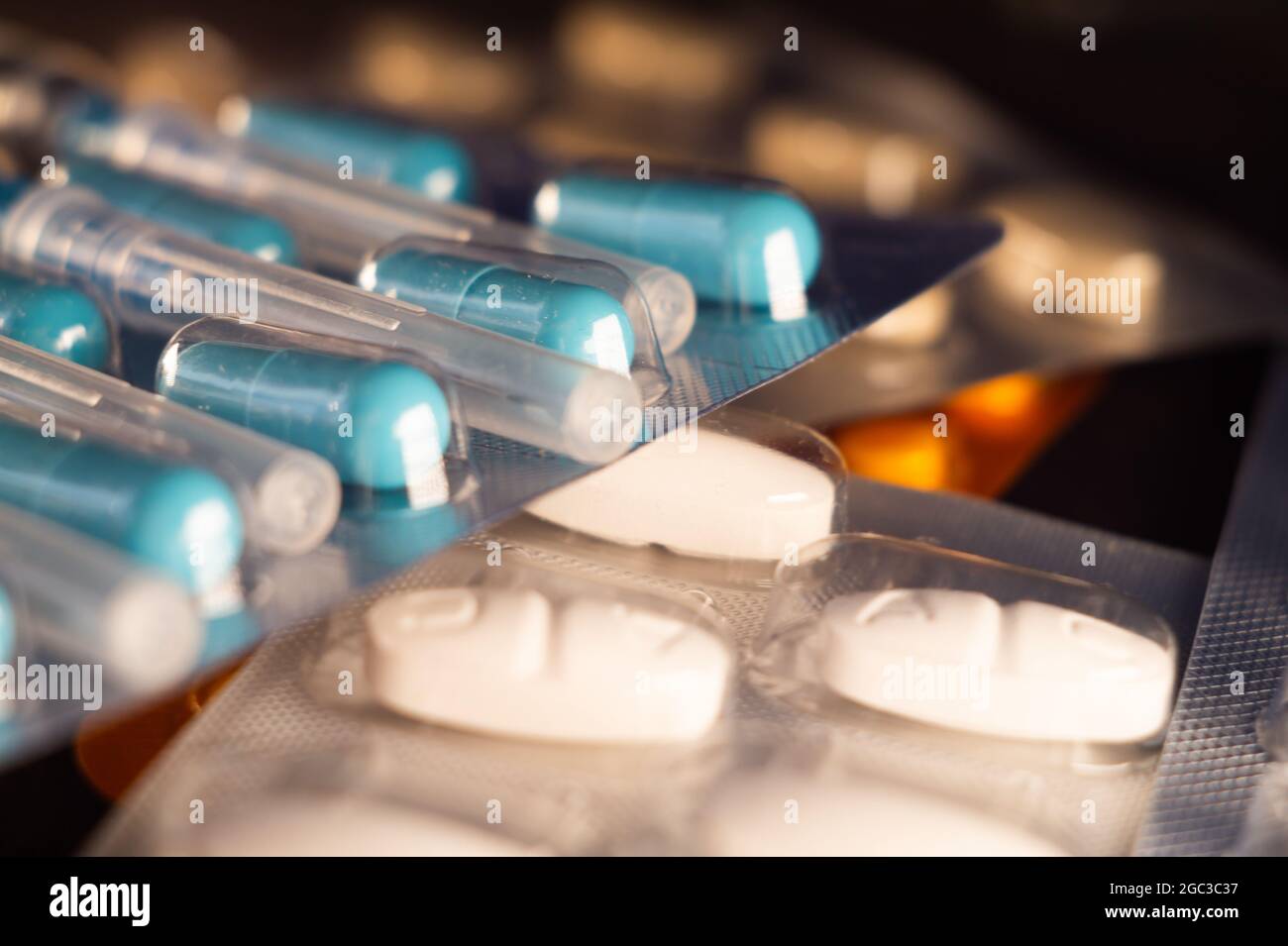 Closeup shot of pharmaceutical capsules, pills and syringes Stock Photo ...