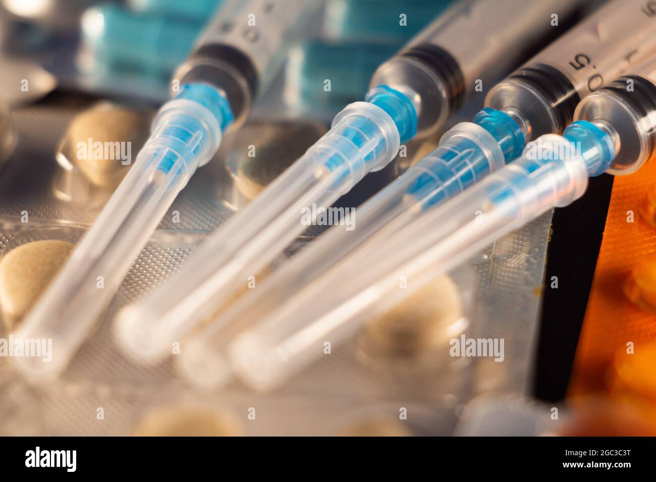 Closeup shot of pharmaceutical capsules, pills and syringes Stock Photo ...