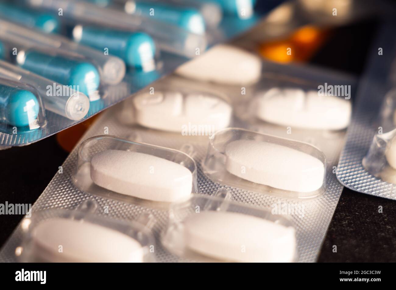 Closeup shot of pharmaceutical capsules, pills and syringes Stock Photo ...