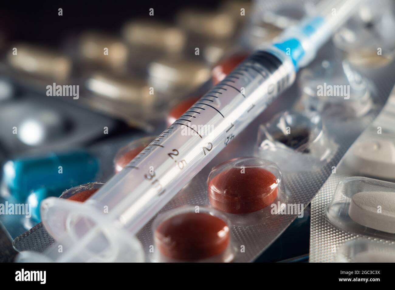 Closeup shot of pharmaceutical capsules, pills and syringes Stock Photo ...