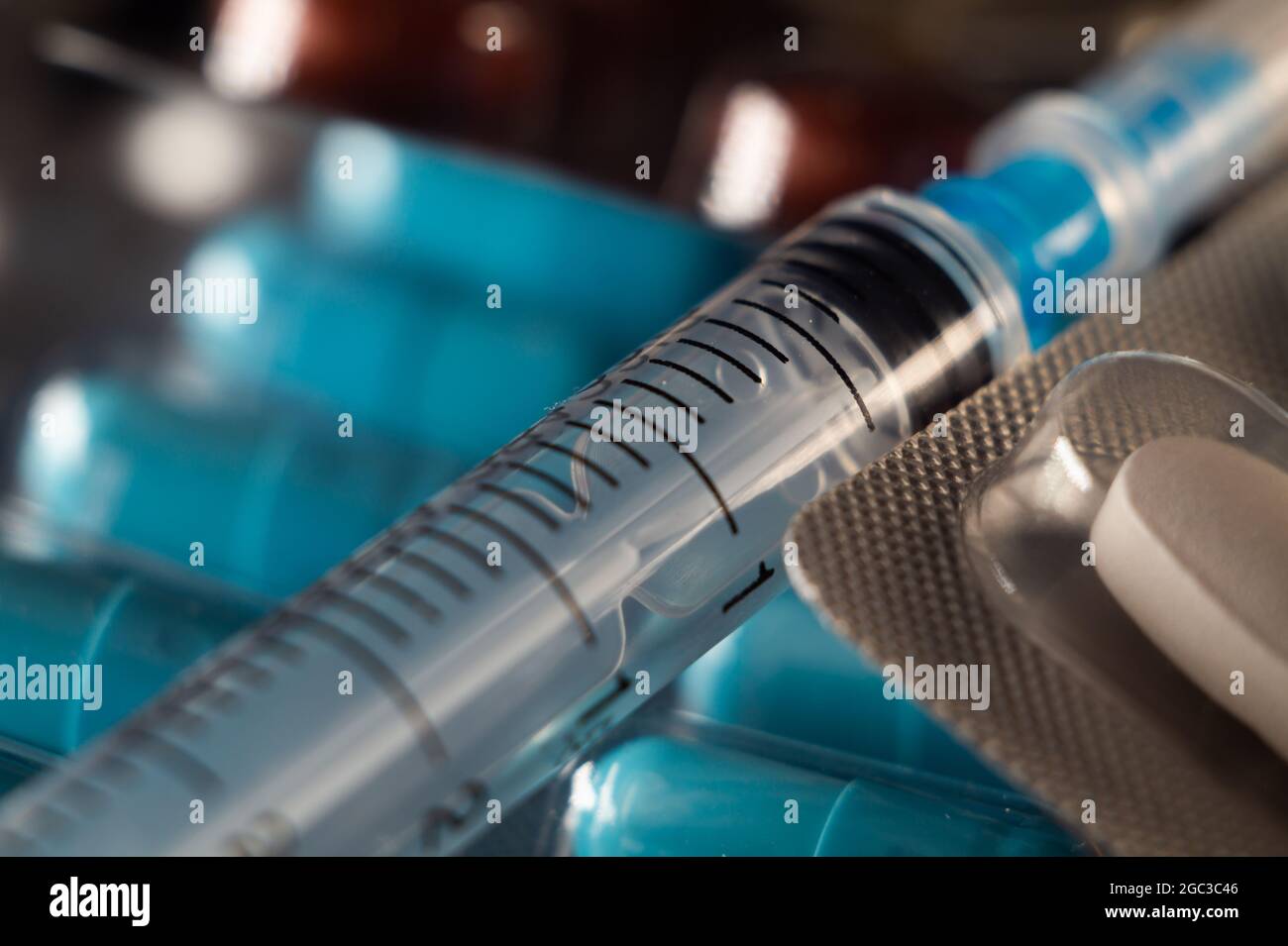 Closeup shot of pharmaceutical capsules, pills and syringes Stock Photo ...