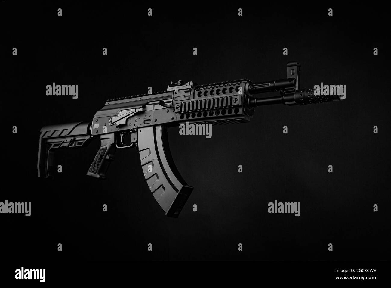 A pneumatic copy of a Russian machine gun. Modern airsoft weapons. Dark ...