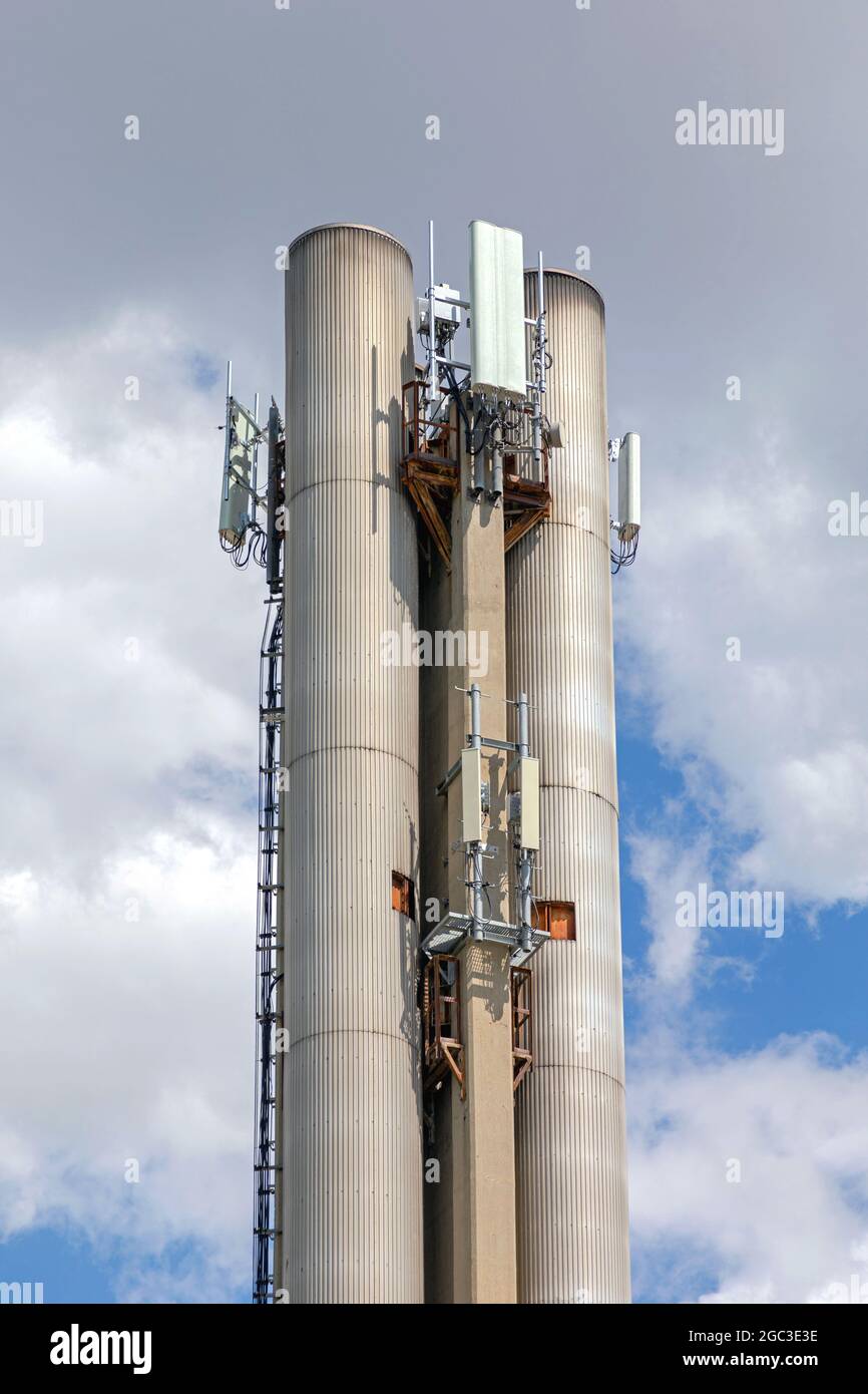 Industrial Chimneys at Power Plant With Cellular Antennas Stock Photo ...