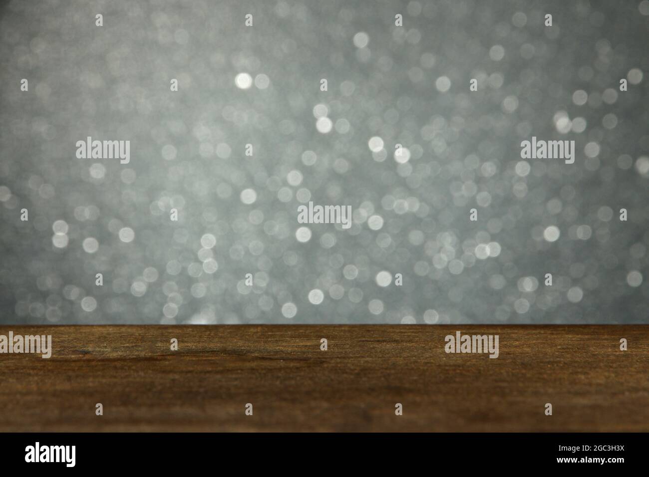 Wooden table on gray background Stock Photo - Alamy