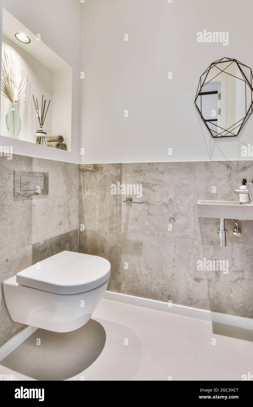 Interior of small clean washroom in miniature style Stock Photo - Alamy