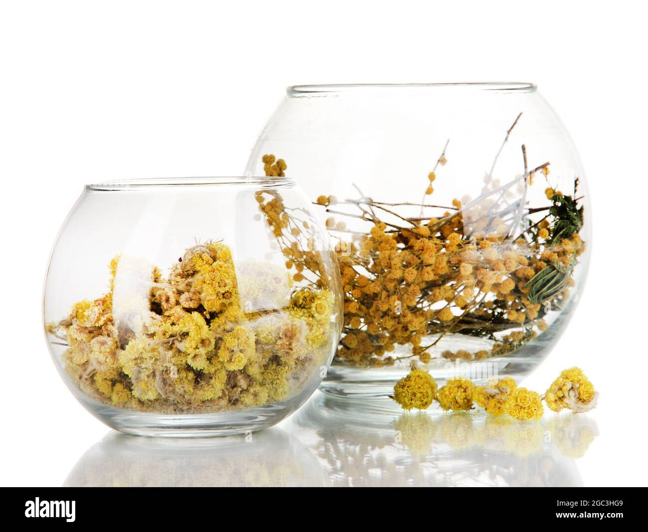 Dried herbs in glass containers isolated on white Stock Photo - Alamy