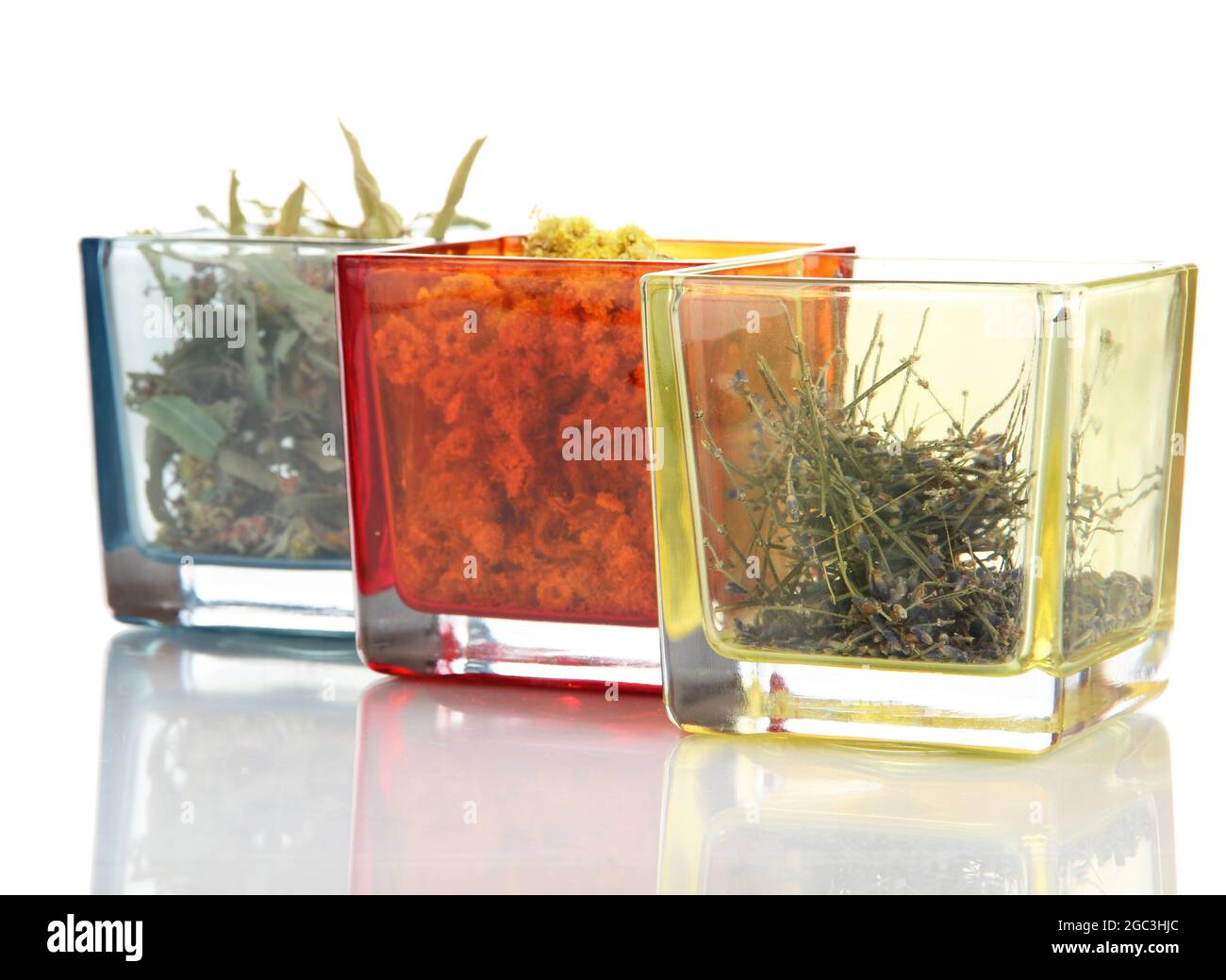 Dried herbs in glass containers isolated on white Stock Photo - Alamy