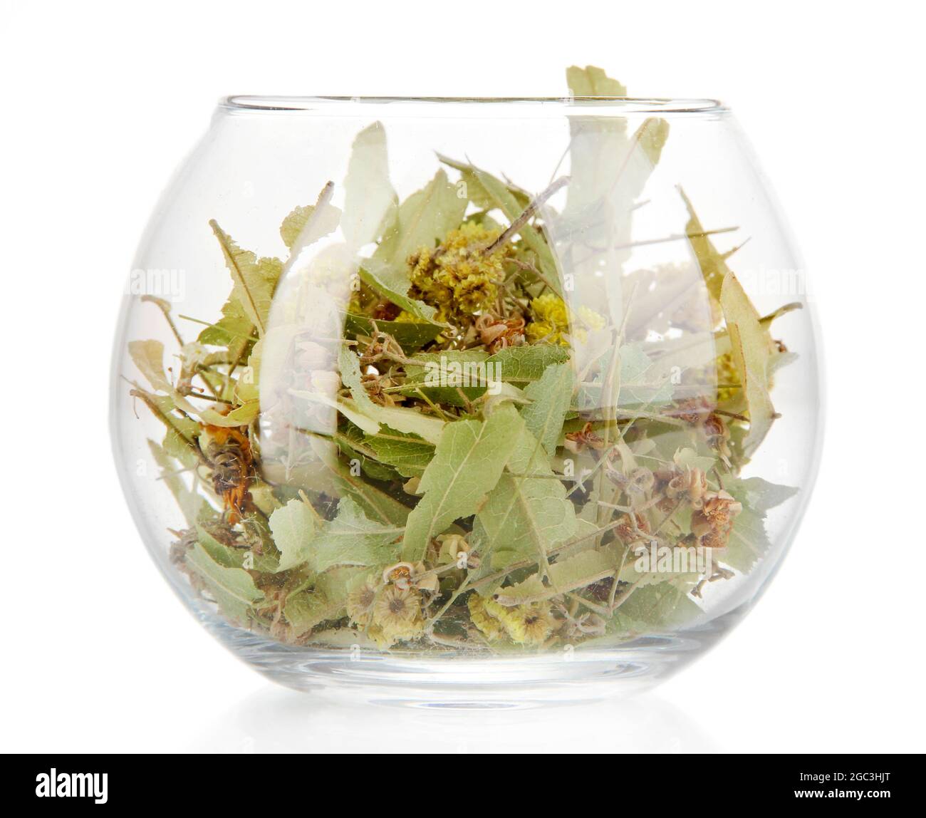 Dried herb in glass container isolated on white Stock Photo - Alamy