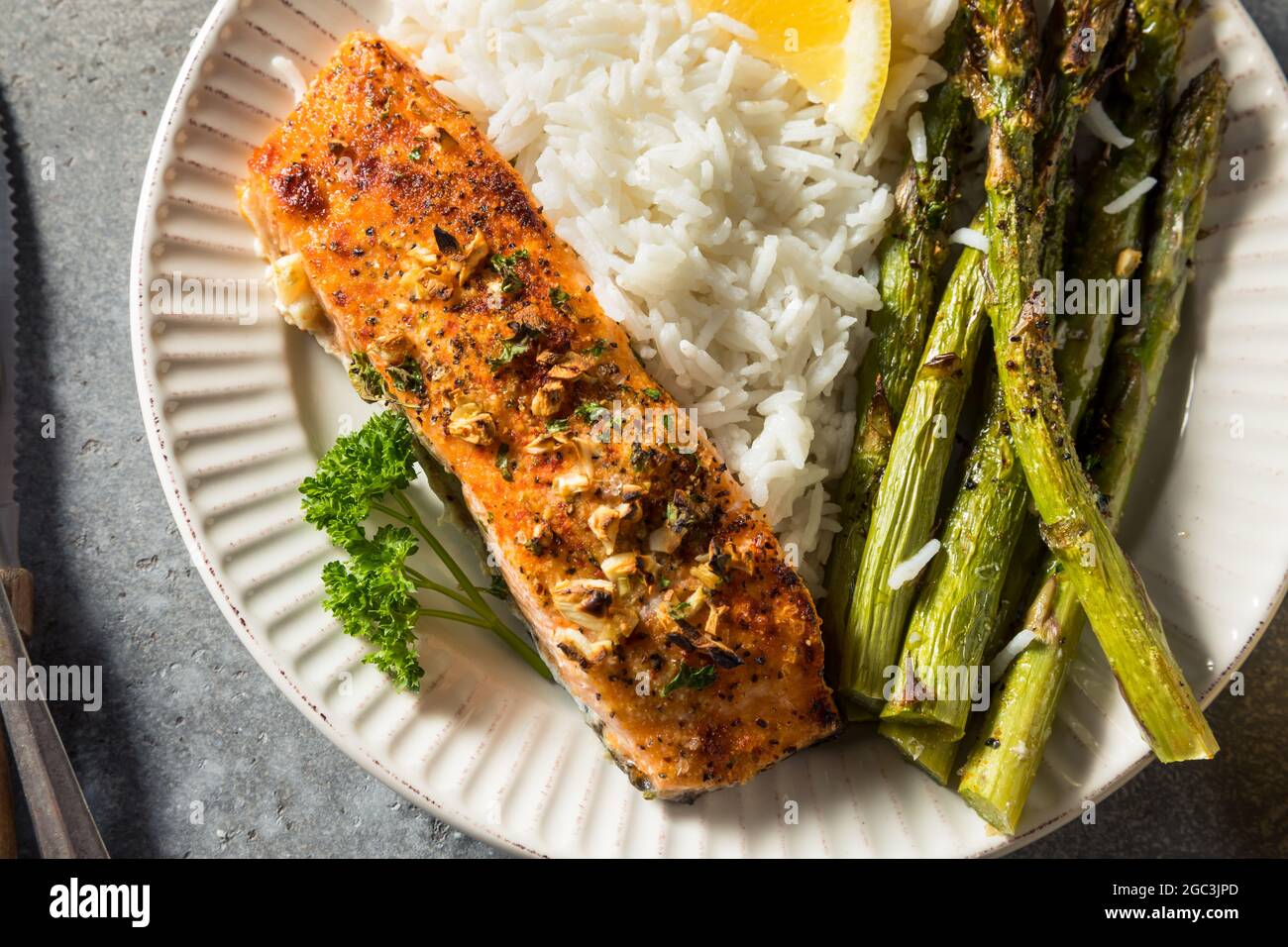 Healthy Homemade Roasted Salmon with Asparagus with Rice Stock Photo ...